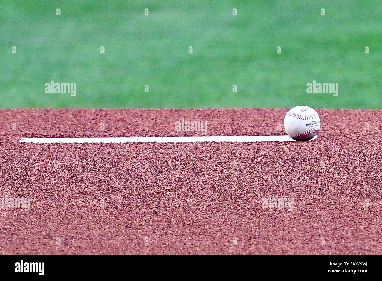 ATLANTA, GA – APRIL 19: A MLB baseball on the mound awaits the start of ...