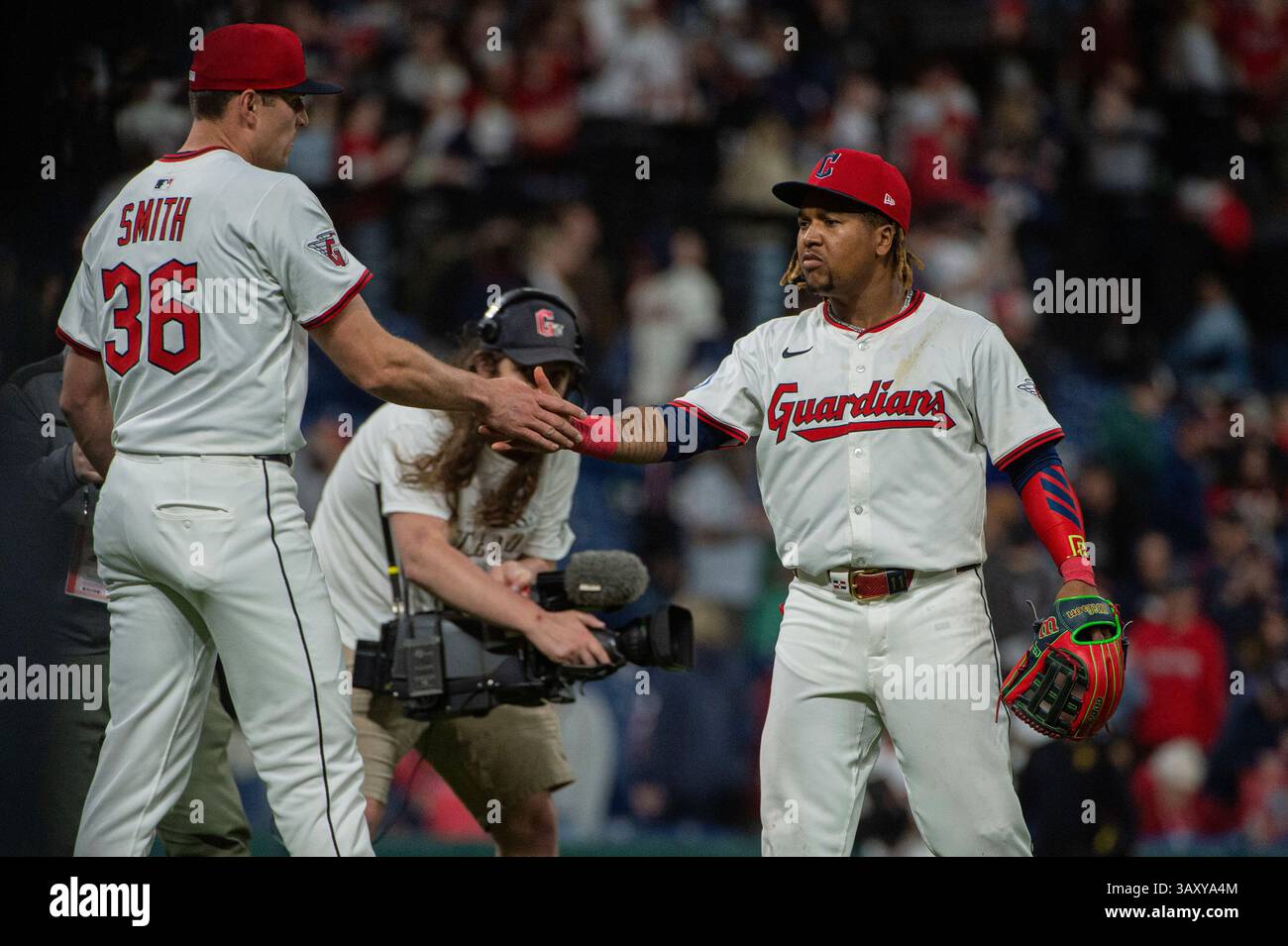 Cleveland Guardians relief pitcher Cade Smith (36) is congratulated by ...