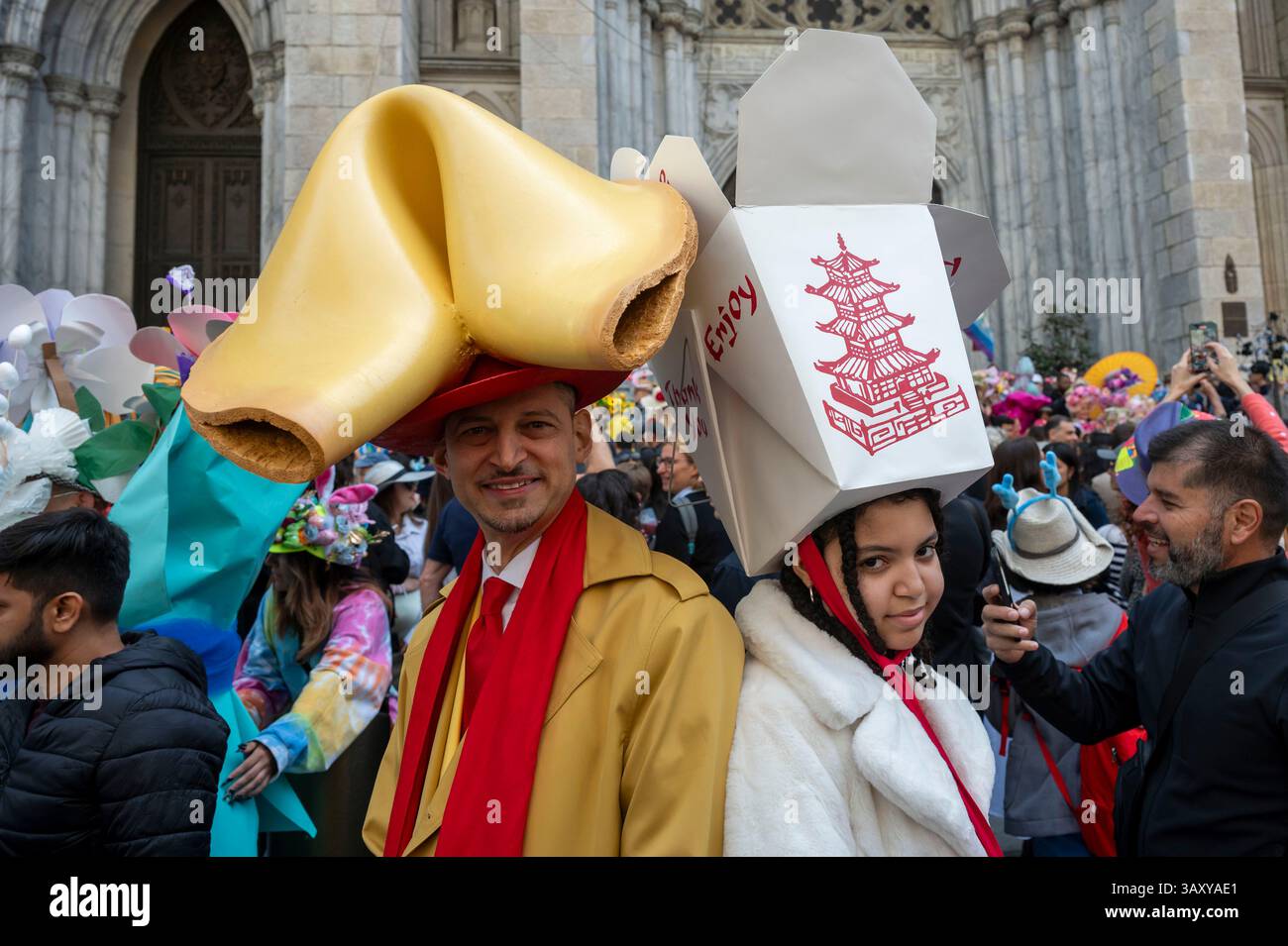 Artist James Haggerty wears a Fortune Cookie hat while his daughter ...
