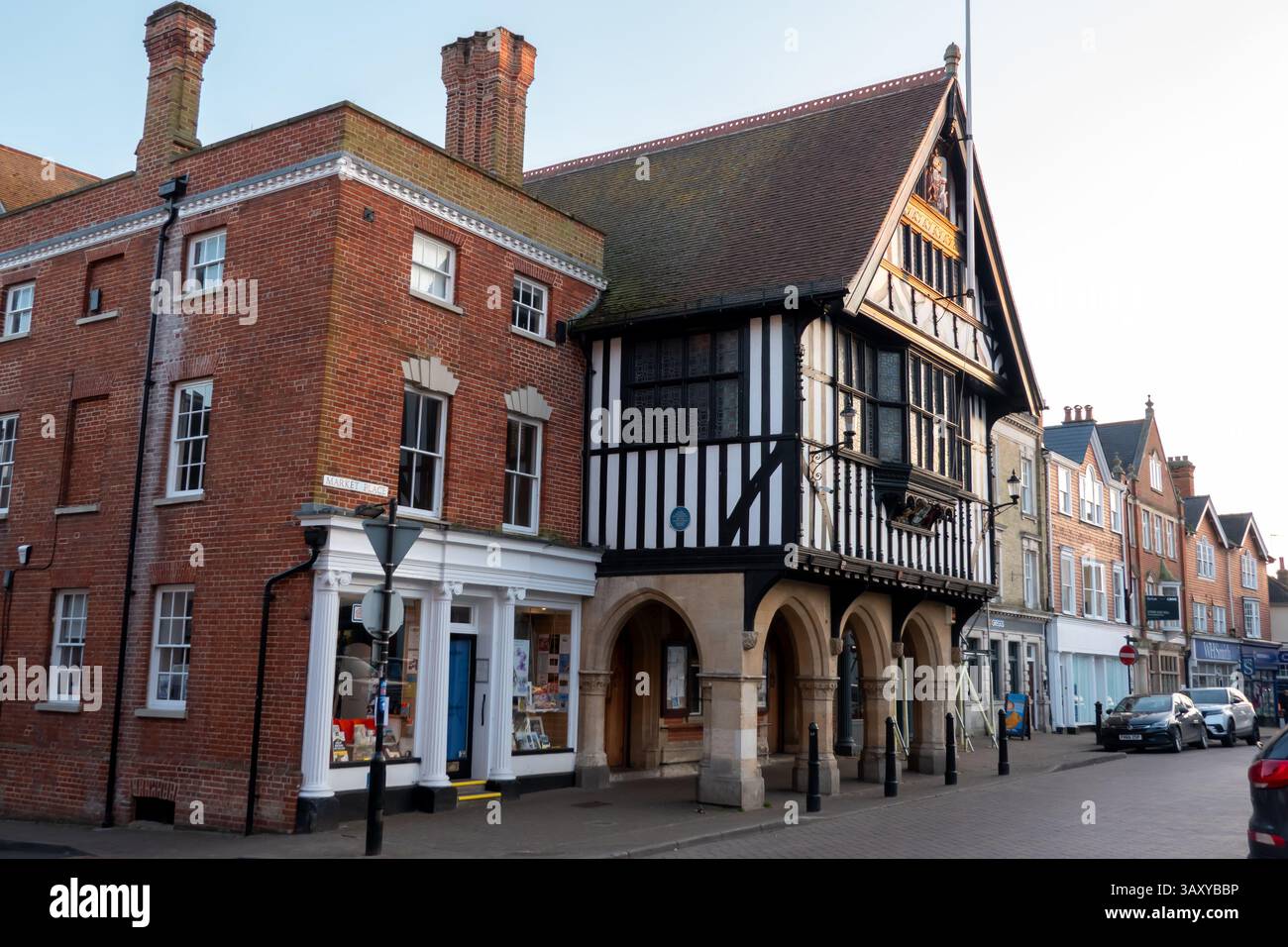 A view of the town hall and historic architecture on a street in ...