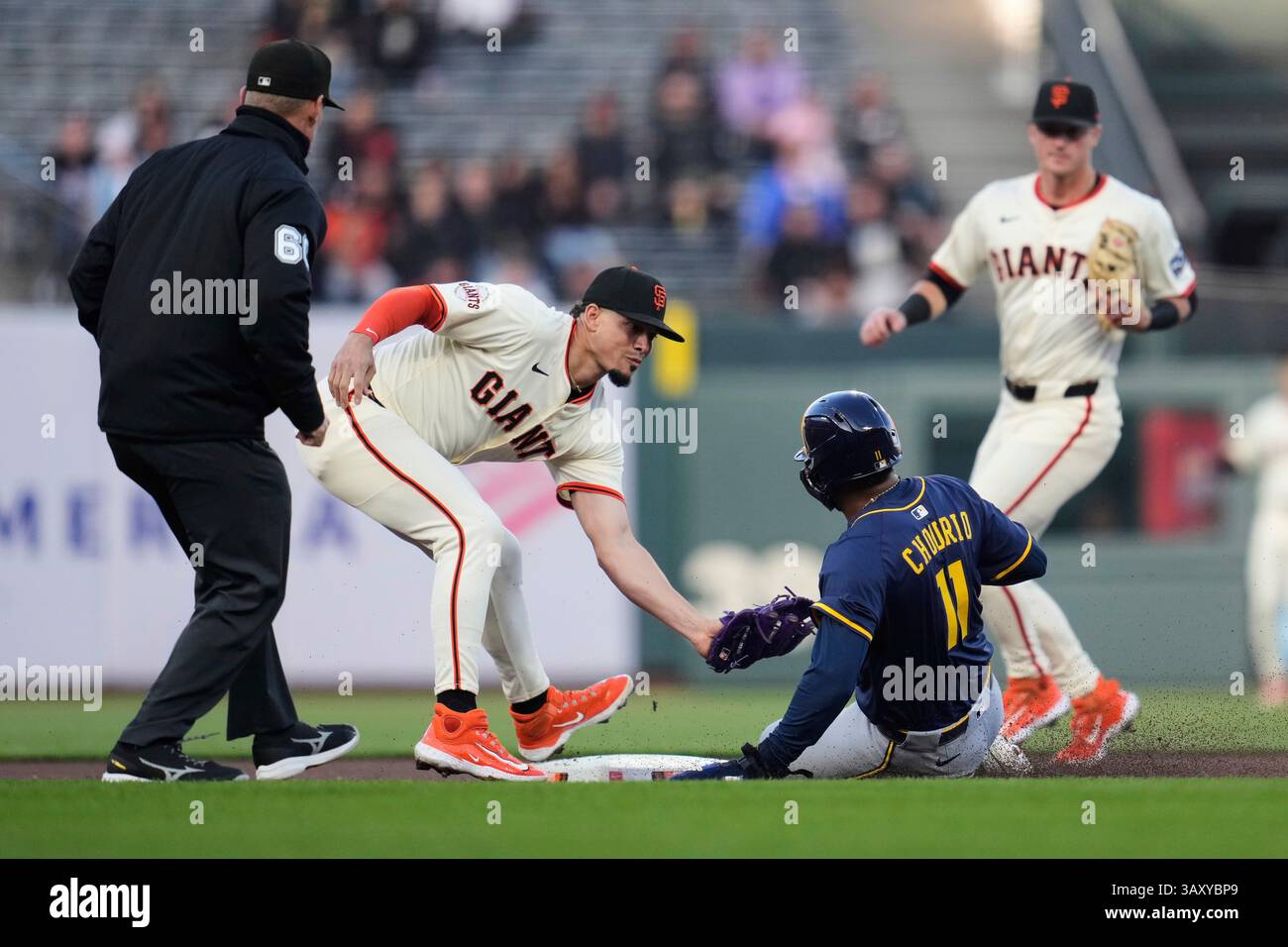San Francisco Giants shortstop Willy Adames, second from left, tags out ...