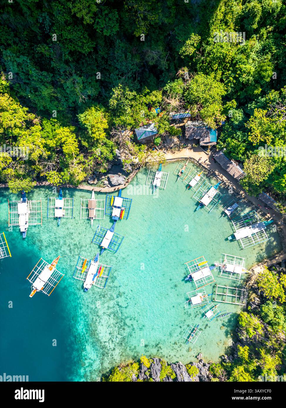 Aerial view of twin lagoon surrounded by limestone cliffs and turquoise ...