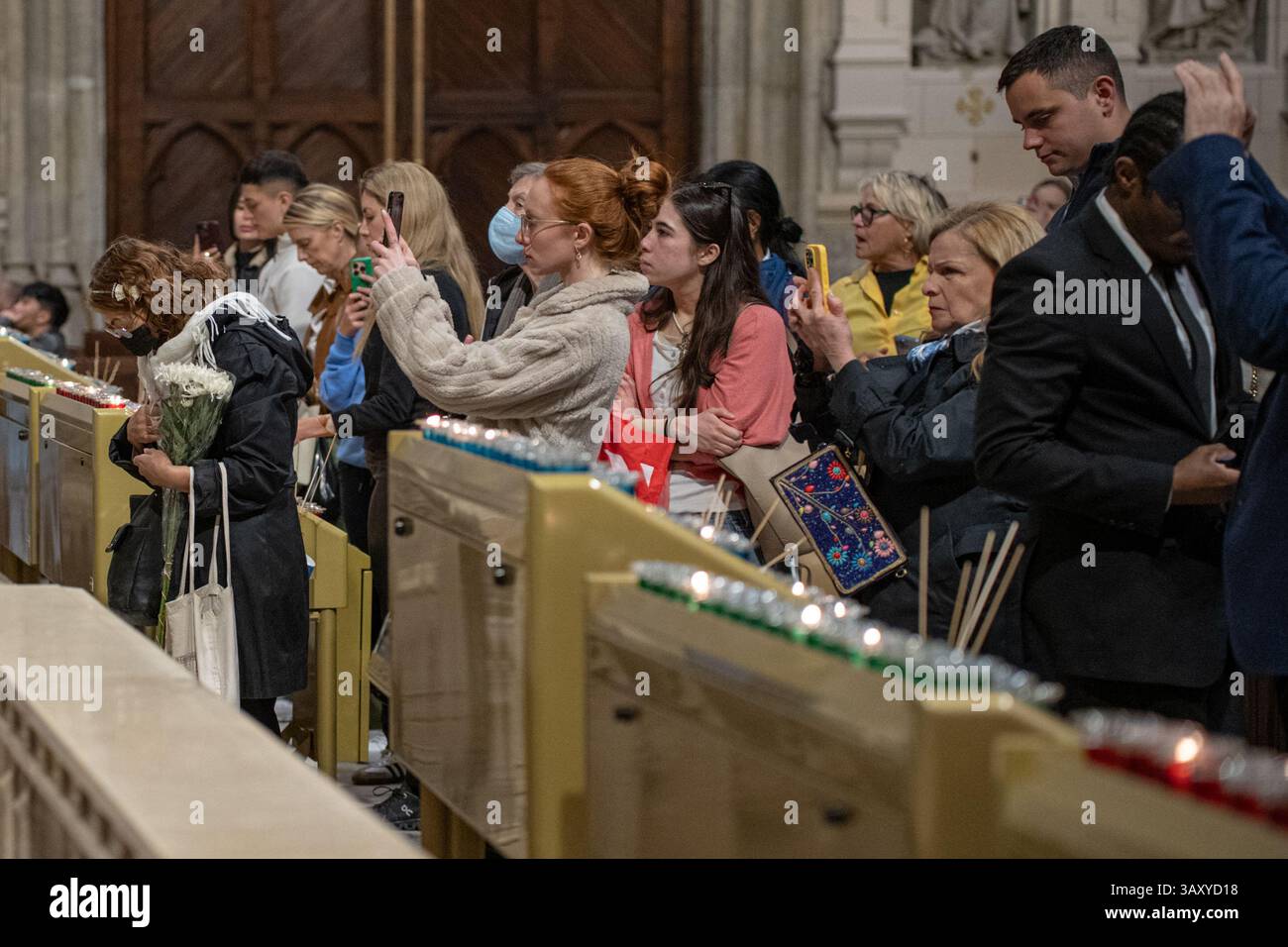 Catholics mourn the death of Pope Francis at St. Patrick's Cathedral in ...