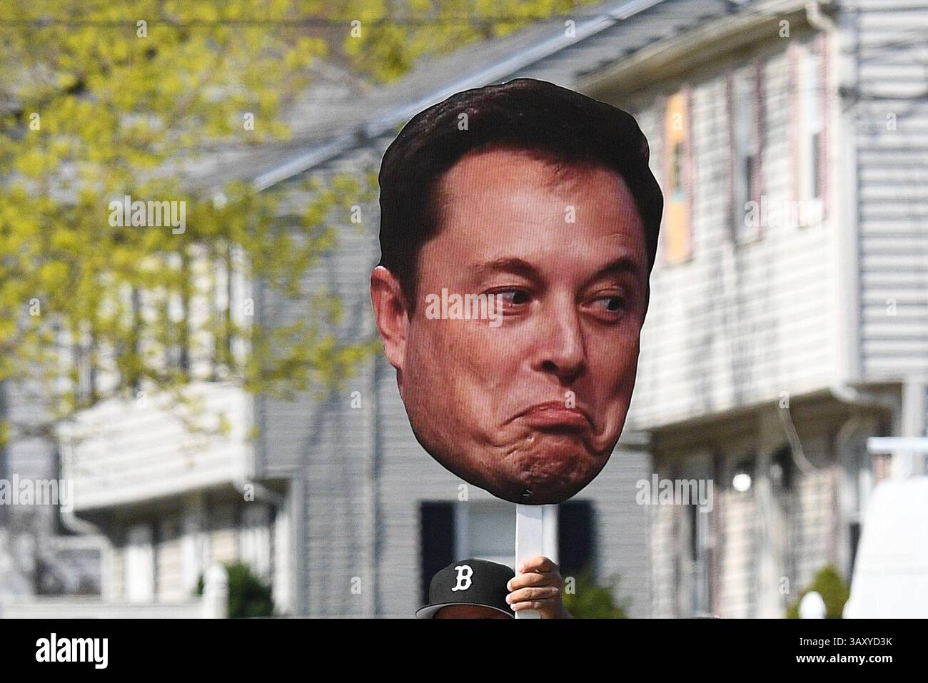 WELLESLEY, MA - APRIL 21: A spectator holds up a sign with a picture of ...