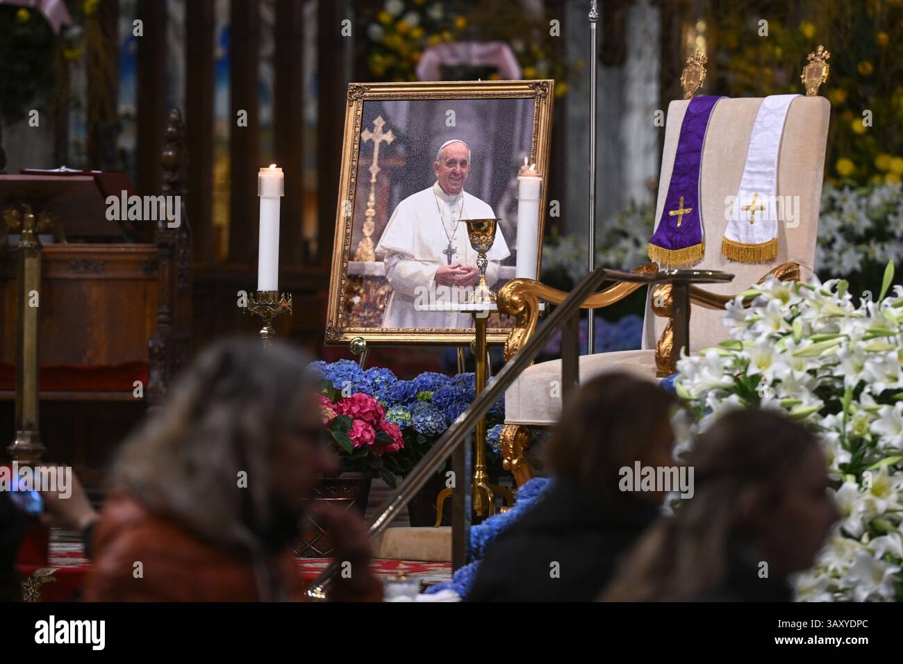 A photo of Pope Francis sits at the altar of St. Patrick's Cathedral to ...