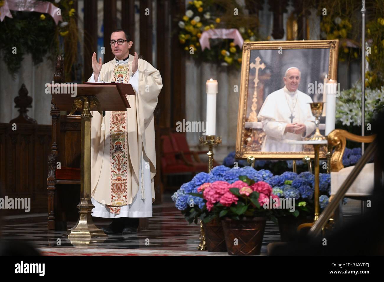 A photo of Pope Francis sits at the altar of St. Patrick's Cathedral to ...