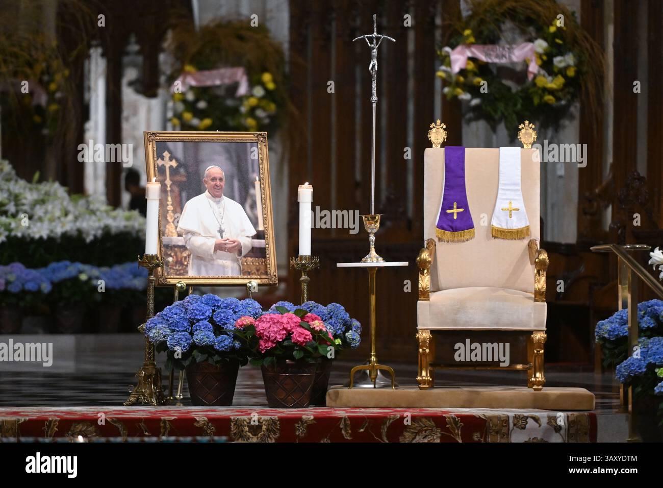 A photo of Pope Francis sits at the altar of St. Patrick's Cathedral to ...