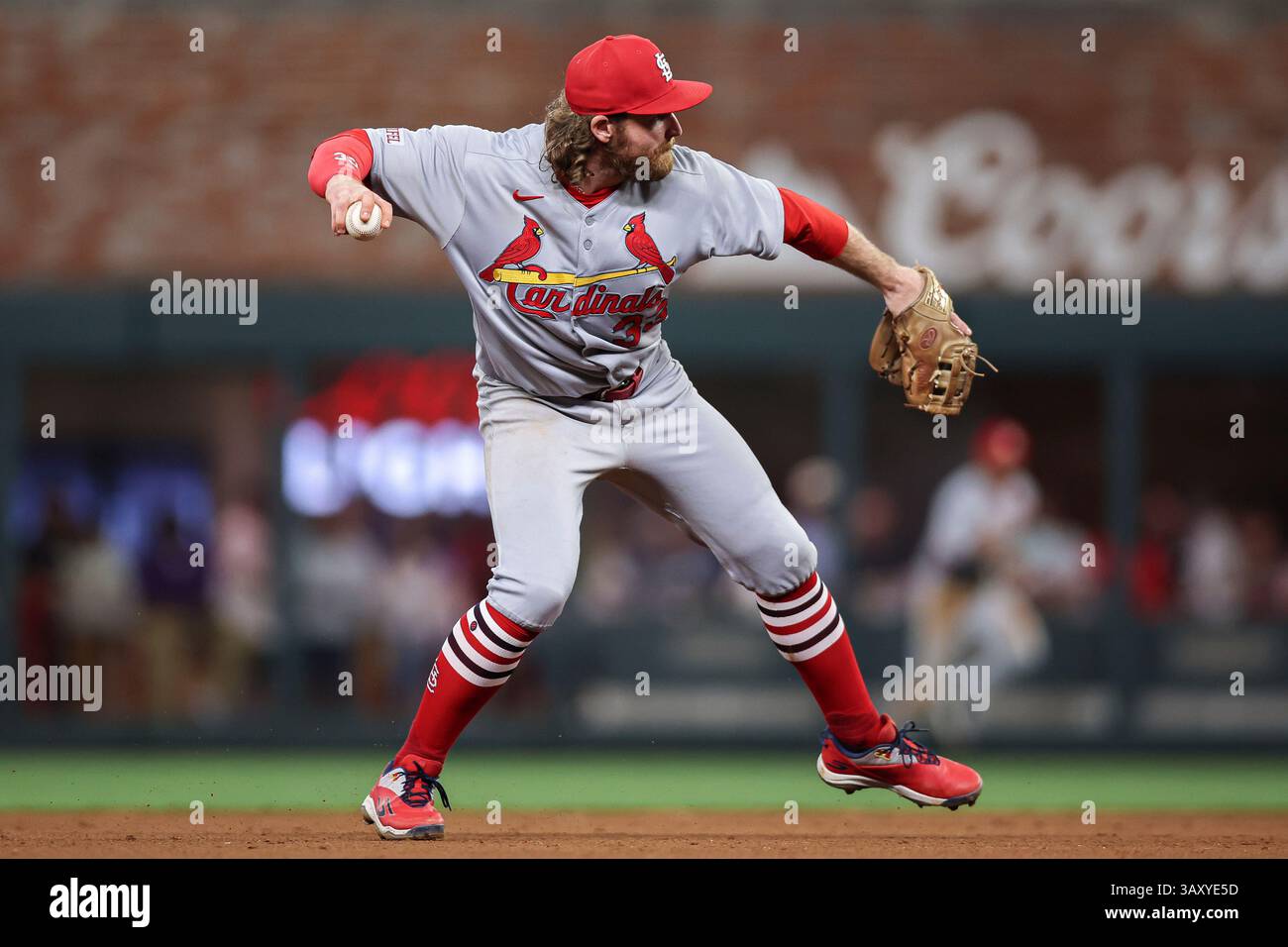 St. Louis Cardinals shortstop Brendan Donovan (33) makes a throw to ...