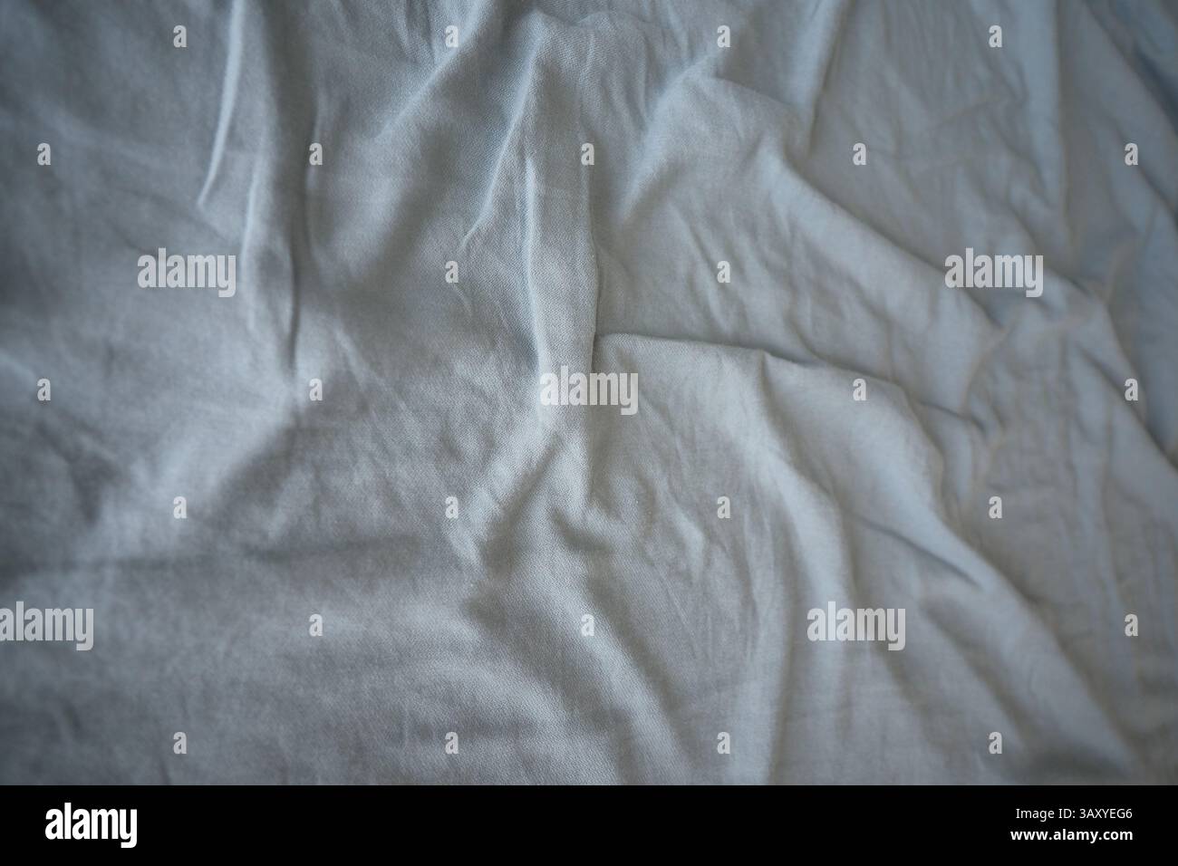 Crisp white fabric draped elegantly across a smooth surface Stock Photo ...