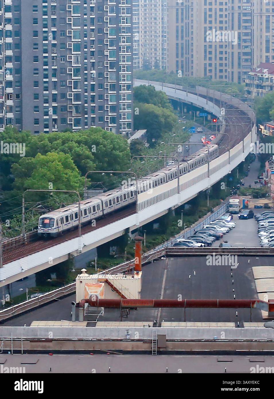 Shanghai, China. 19th Apr, 2025. Shanghai Metro Line 3 runs among high ...