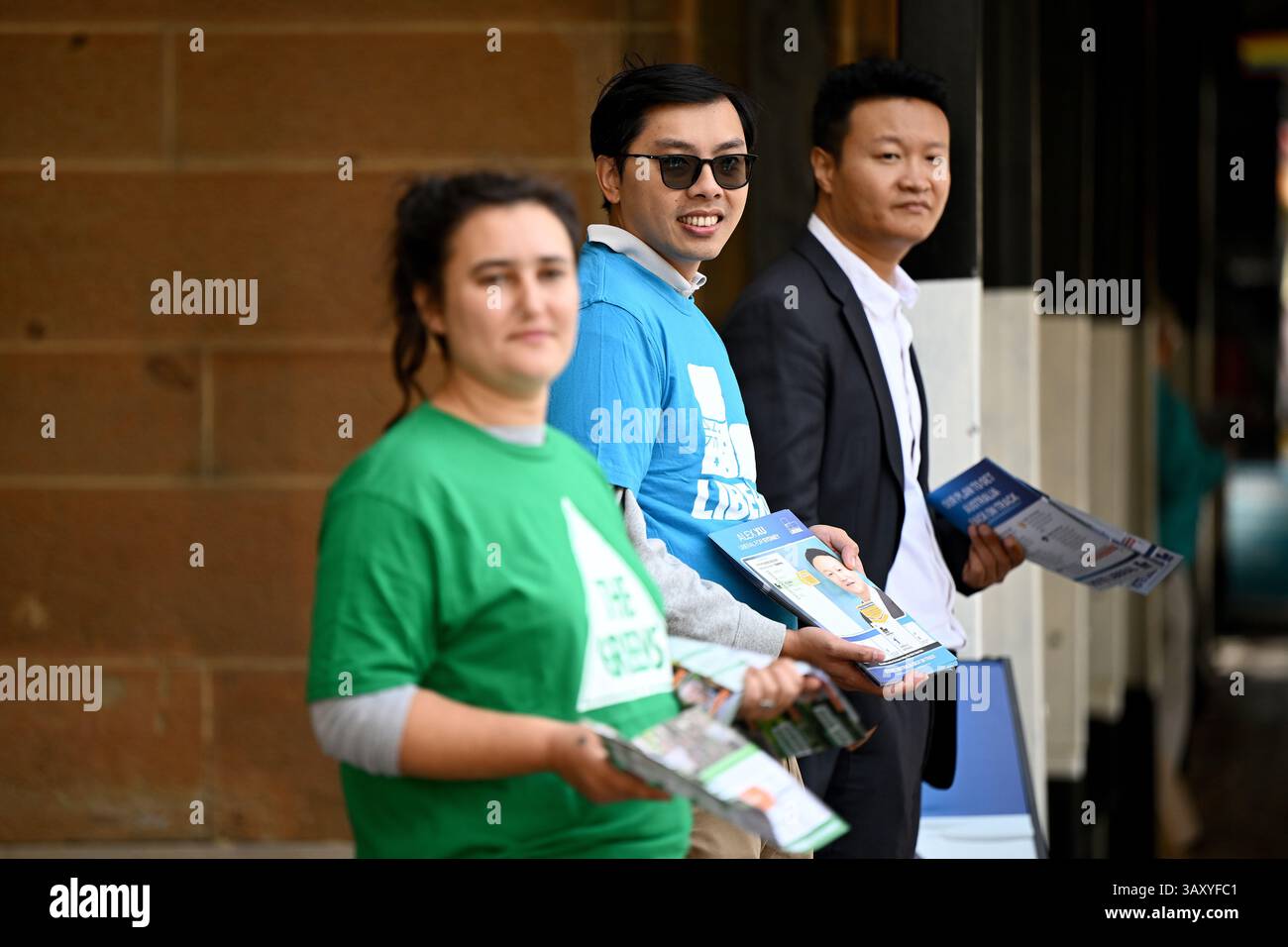Sydney, Australia. 22nd Apr, 2025. Political party volunteers line the ...