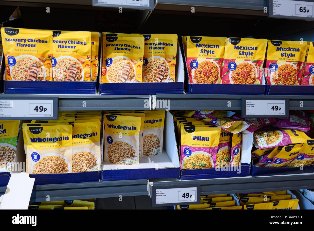 Microwavable rice packs on a shelf inside a Lidl – Wales, UK – 17 April ...