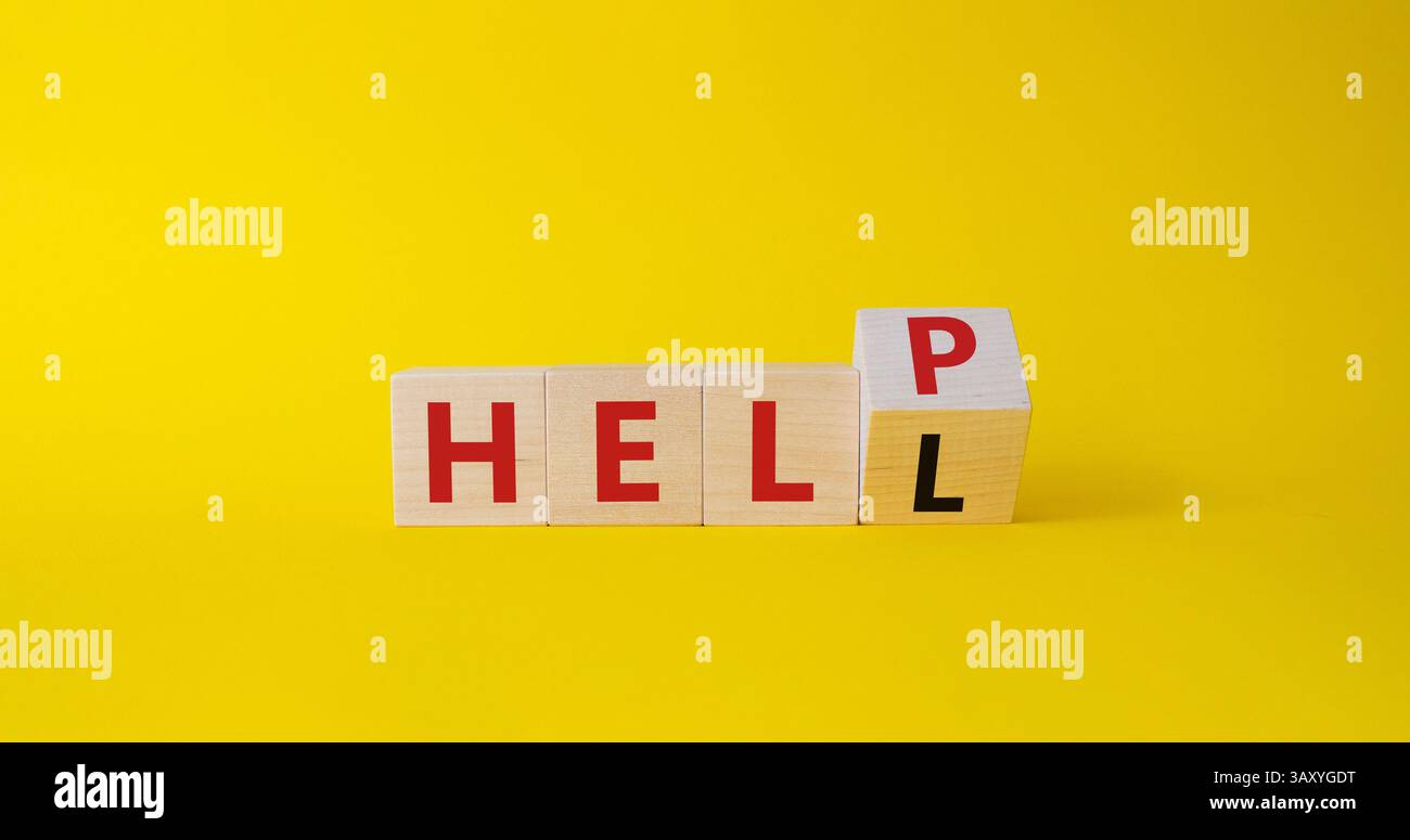 Help vs Hell symbol. Turned wooden cube with words Hell and Help. Beautiful yellow background ...