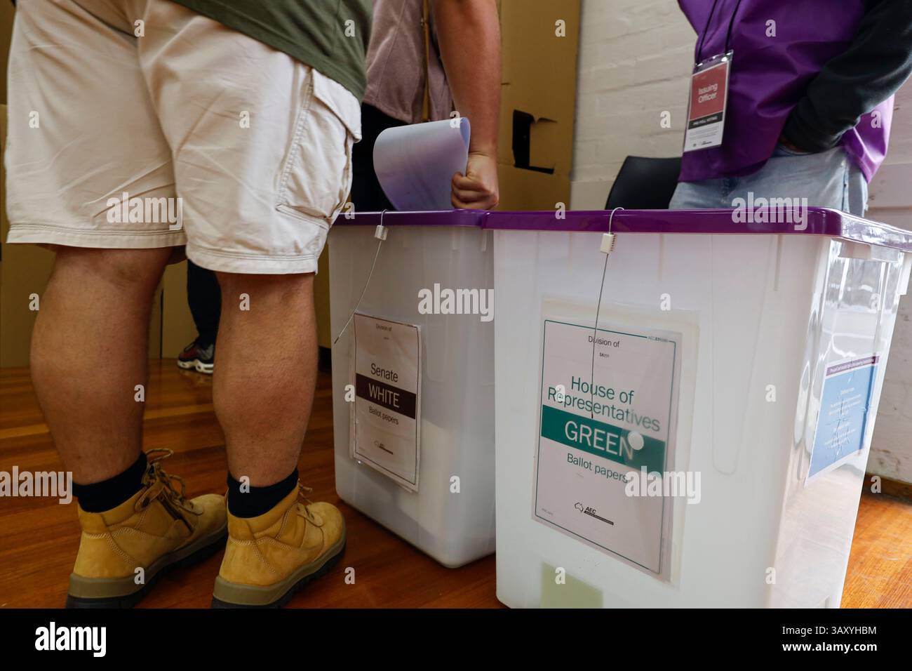 A person places their ballot into a box at a polling centre during ...