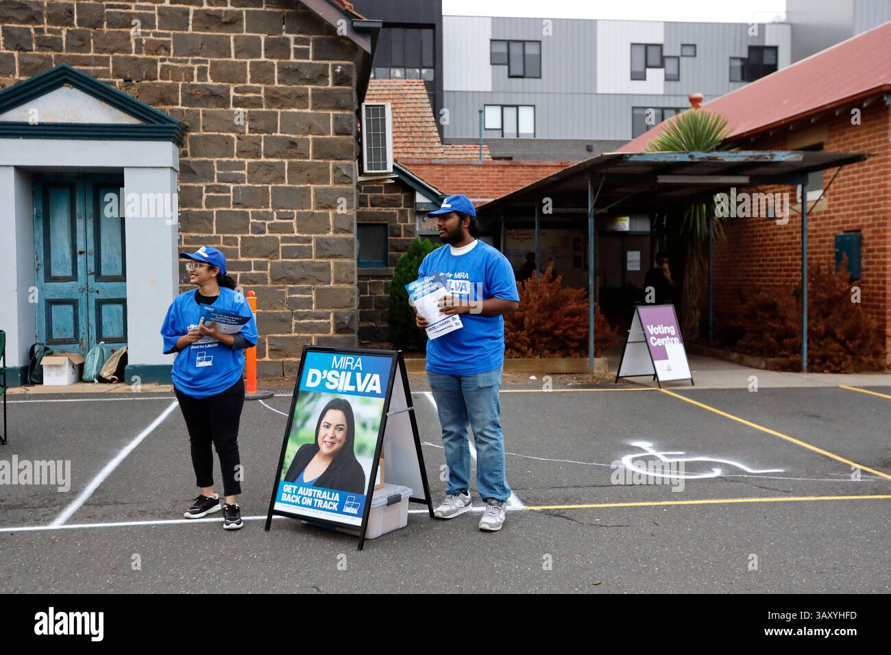 A Liberal Party campaign poster is seen outside a polling centre during ...