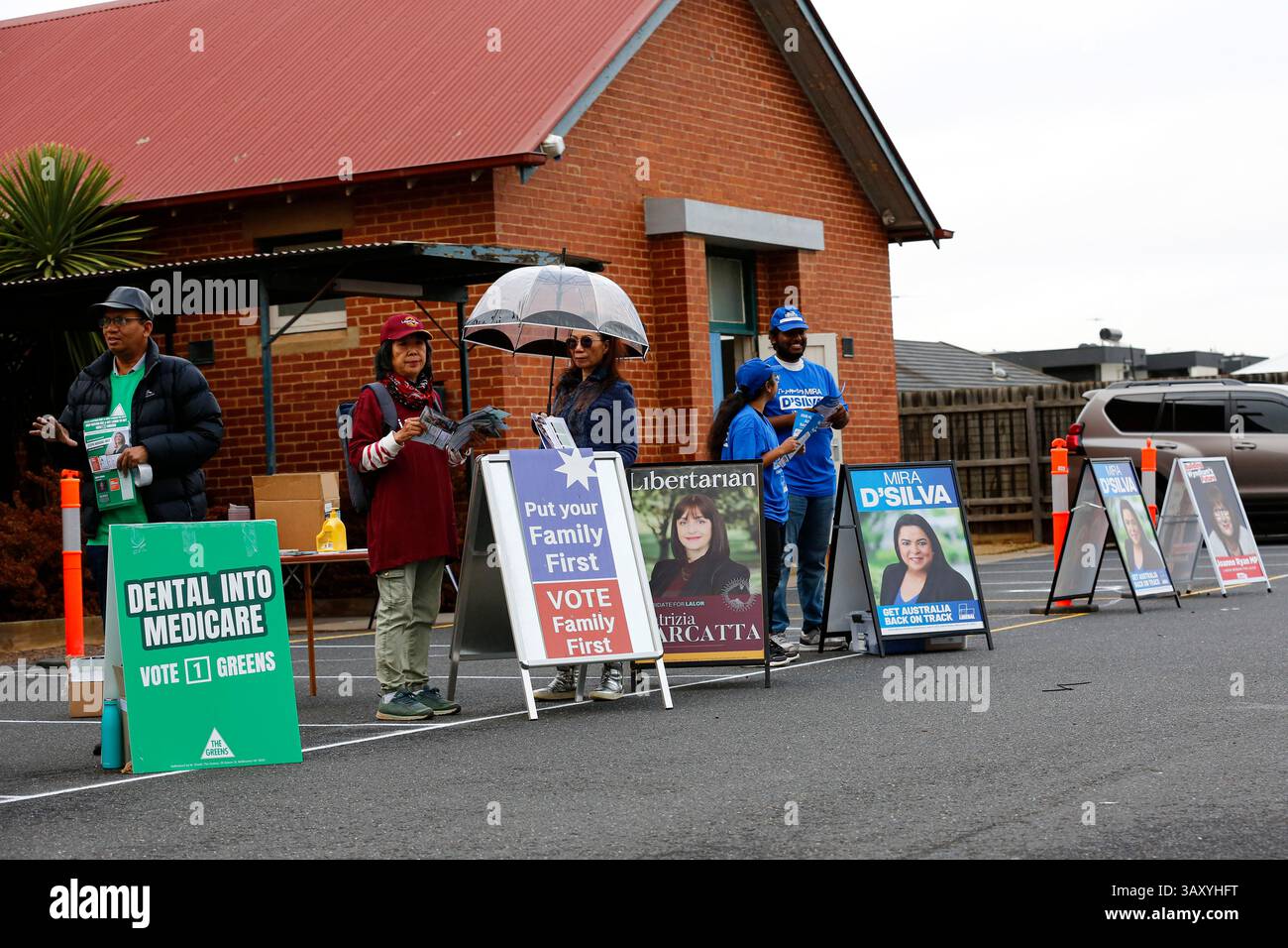 Campaign posters and signs are seen outside a polling centre during ...