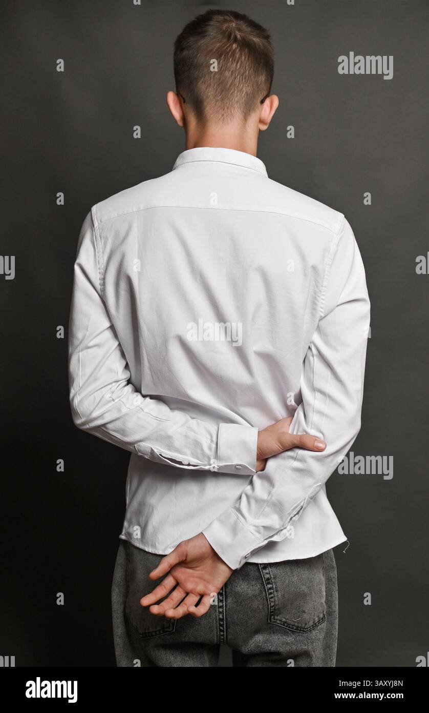 With hands clasped behind his back hi-res stock photography and images ...