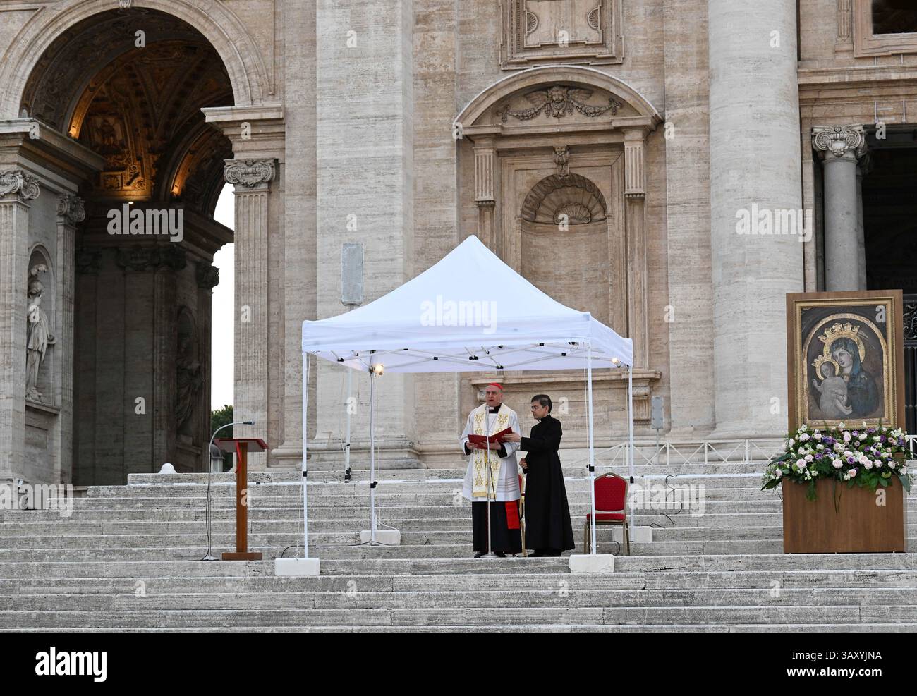 Faithful attend an evening Rosary held in St. Peter's Square, Vatican ...