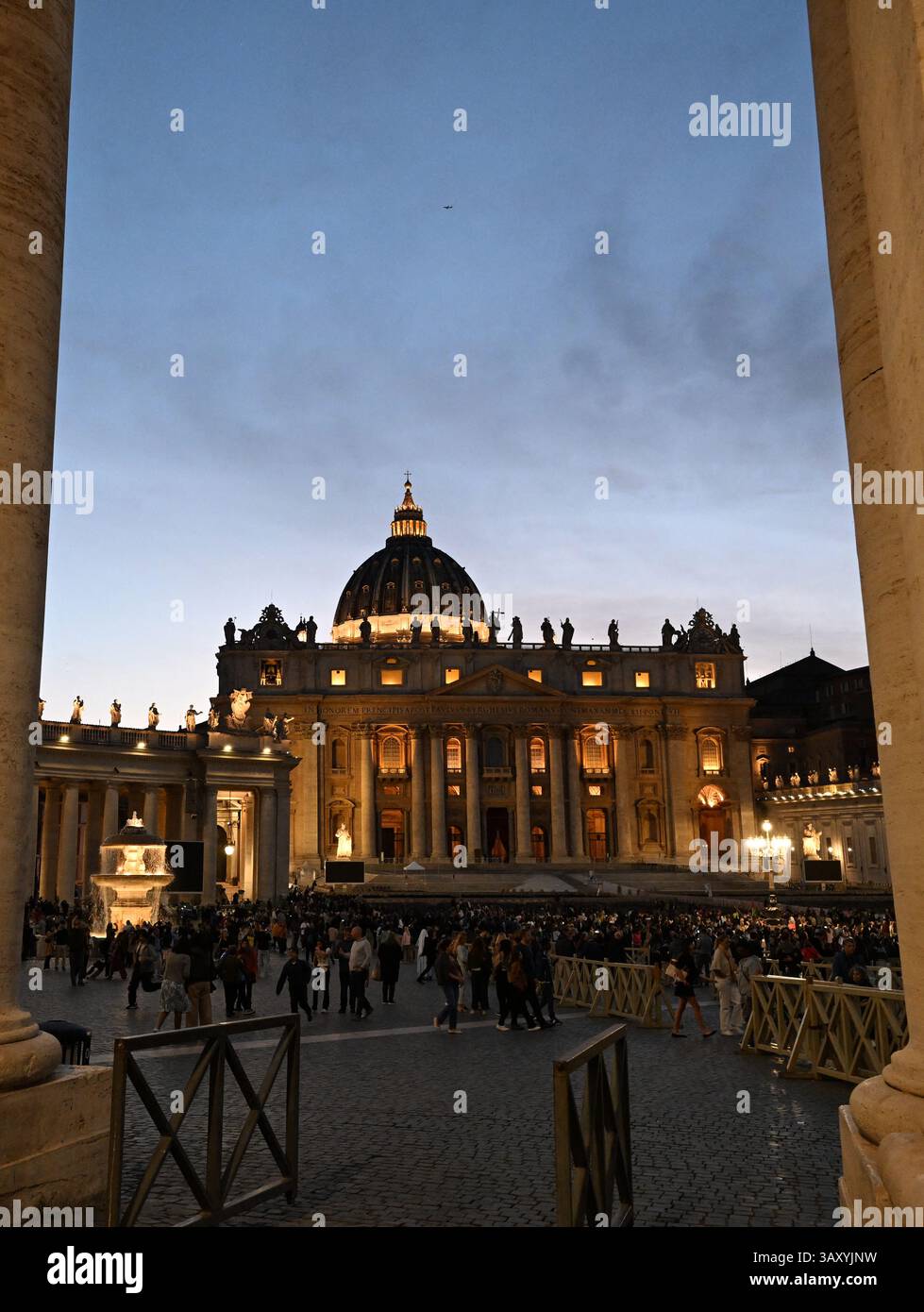 Faithful attend an evening Rosary held in St. Peter's Square, Vatican ...