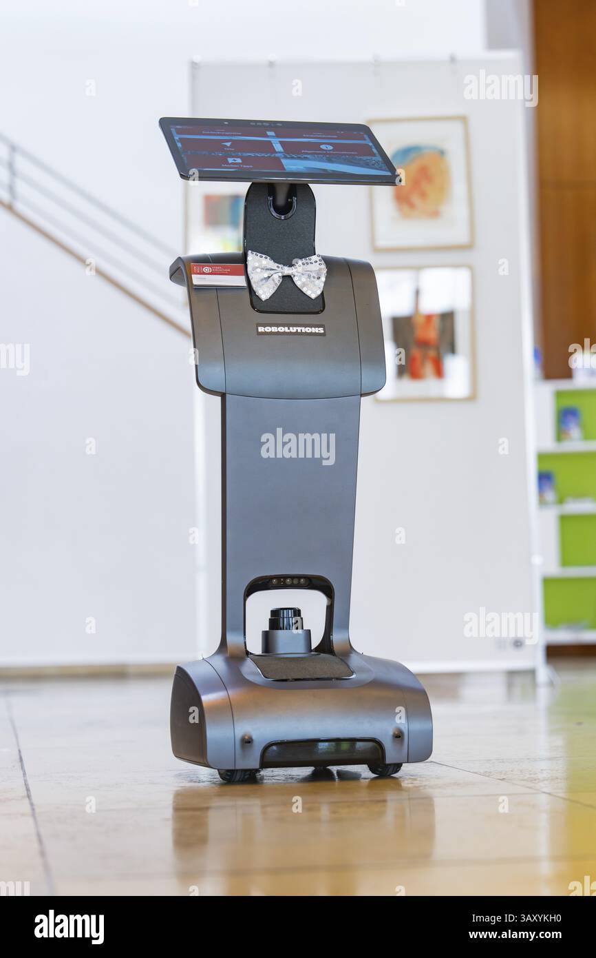 Robots with display in an artistically furnished modern interior ...