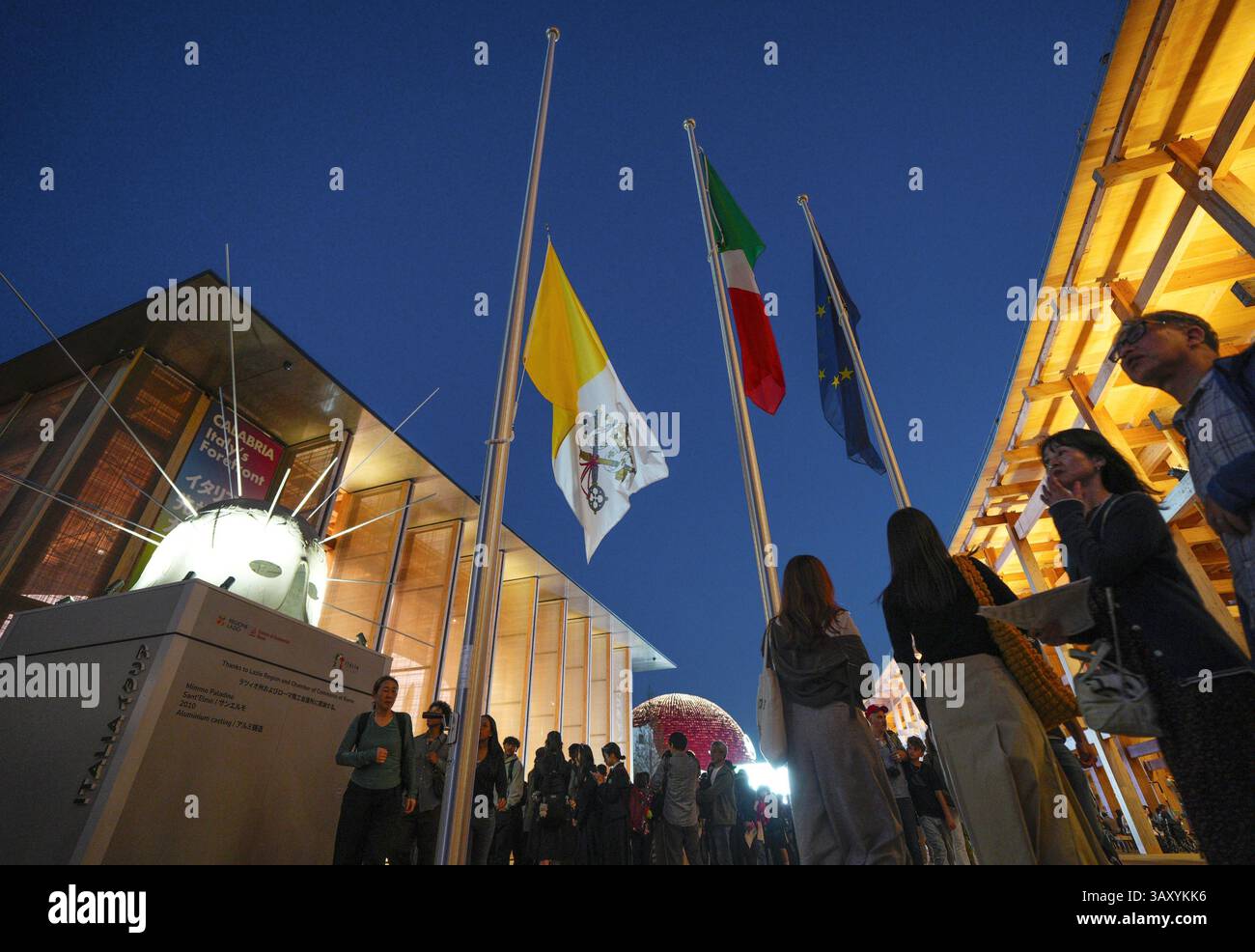 The flag of the Vatican flies at half-staff at its joint pavilion with ...