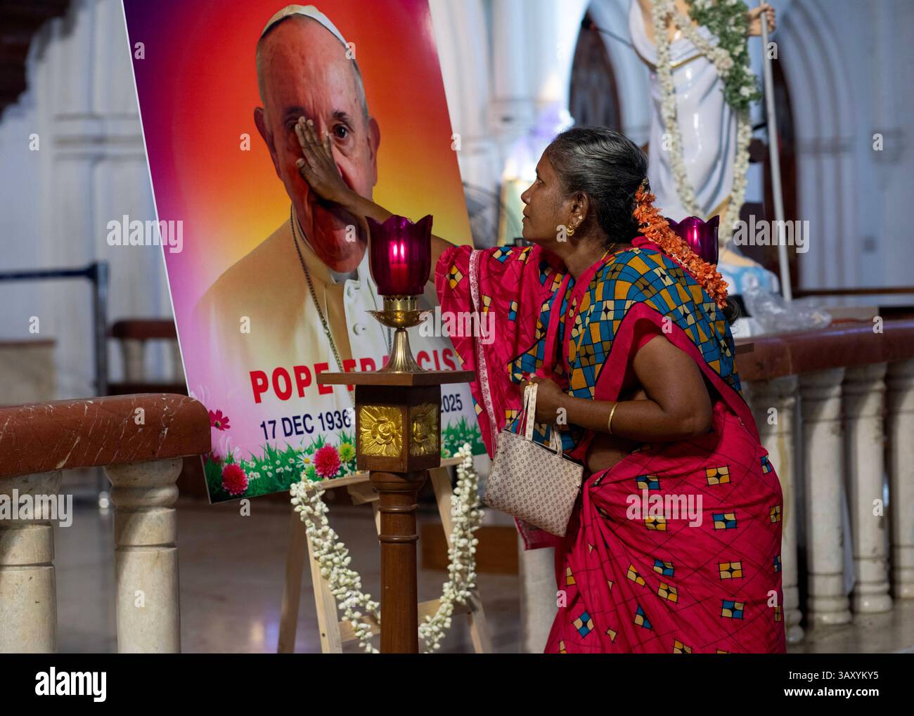 Reactions to Pope Francis death in Chennai, India An elderly woman pays ...