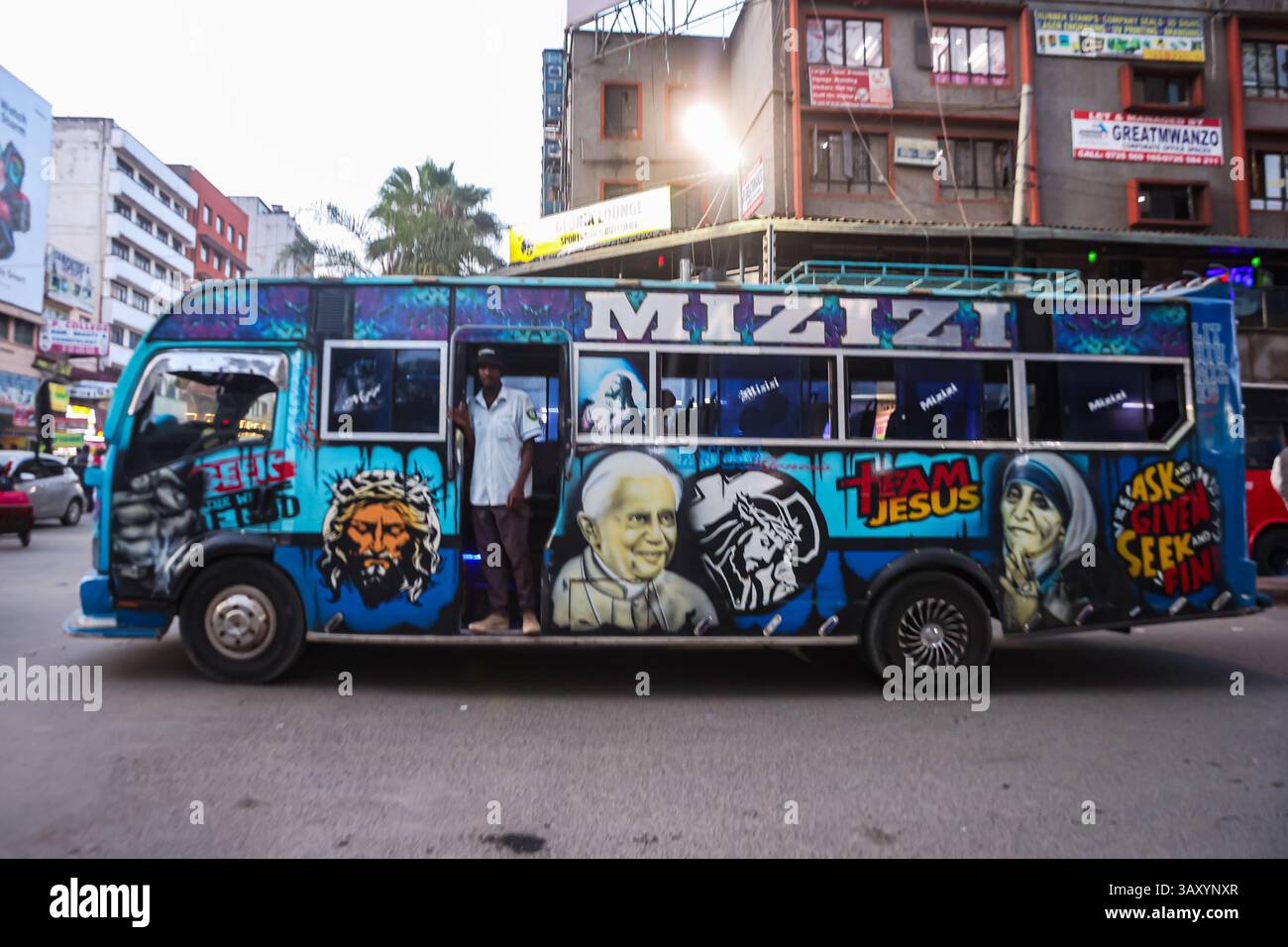 A matatu (Mini bus) along Ronald Ngala street in Nairobi bearing ...
