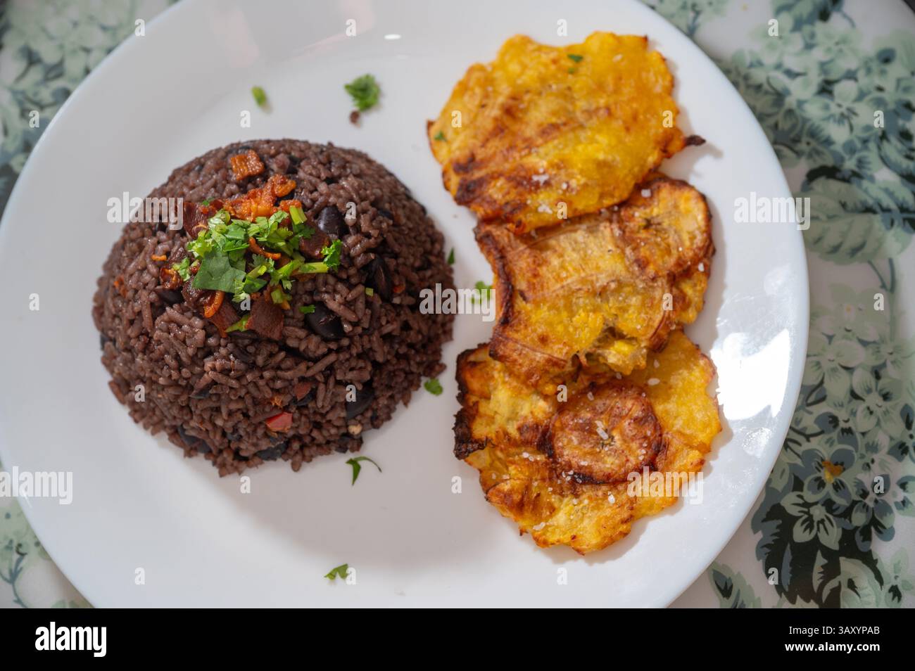 Rice Congri and Plantain Tostones, Delicious Cuban Food Stock Photo - Alamy