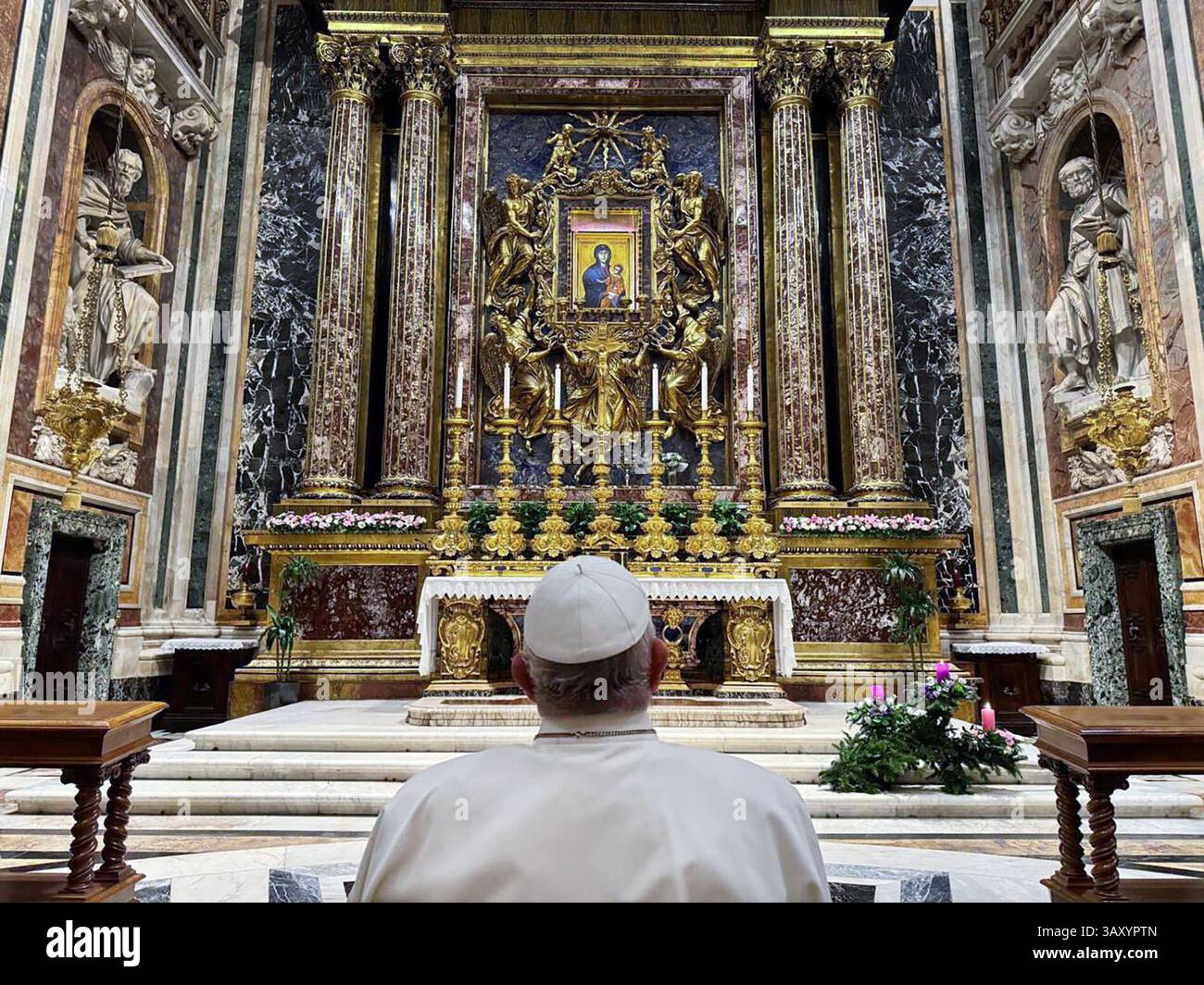 File photo - Pope Francis is praying in the chapel Paolina of the ...