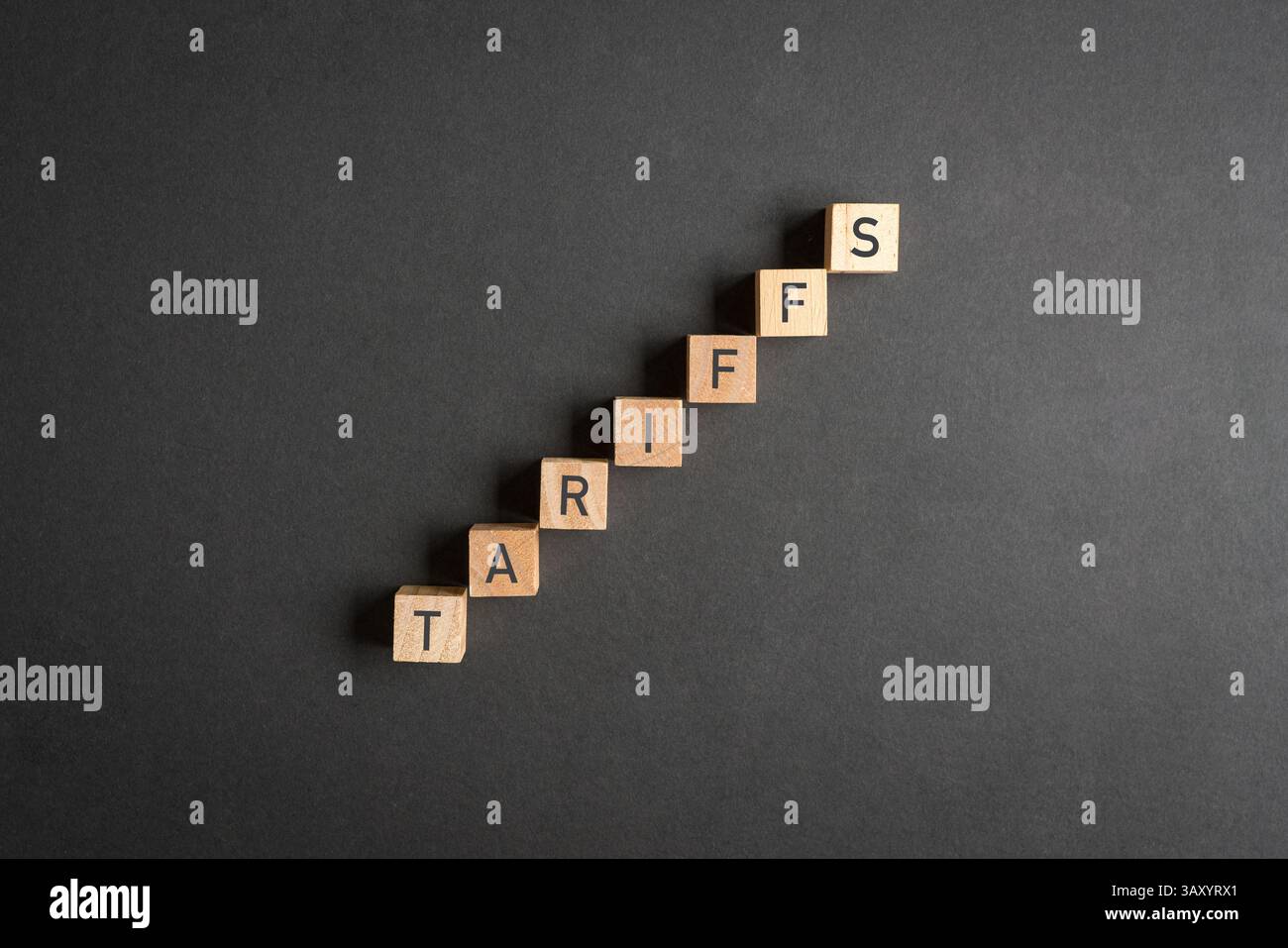 Tariffs, word on square wooden blocks, stacked and in step going up ...