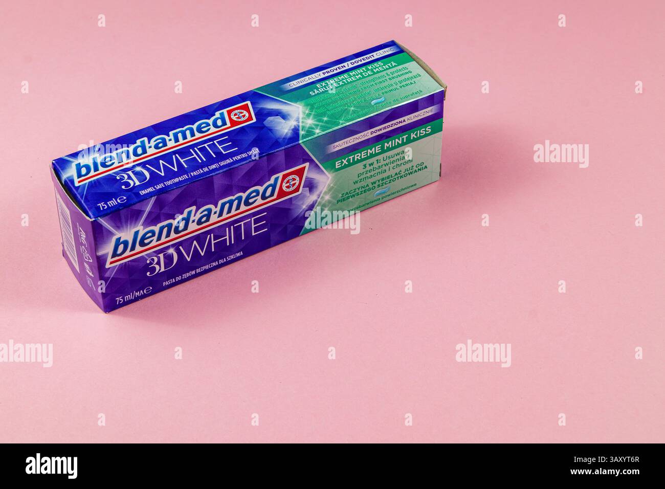 Lviv Ukraine 05.04.25 A toothpaste box sits on a pastel pink background ...