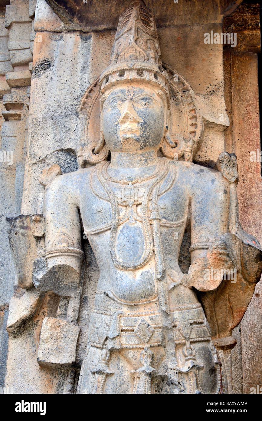 Carving details on the idol of a Dwarpal (gate keeper), Pandeshwar ...