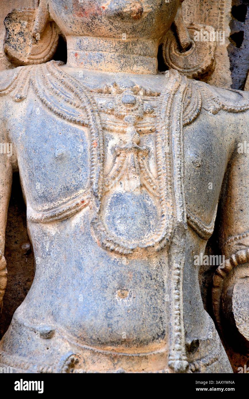 Carving details on the idol of a Dwarpal (gate keeper), Pandeshwar ...