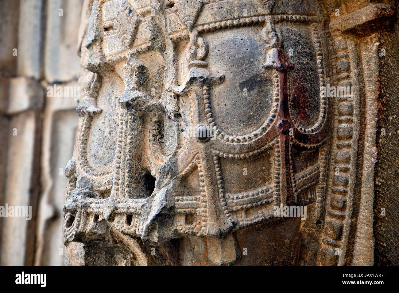 Carving details on the idol of a Dwarpal (gate keeper), Pandeshwar ...