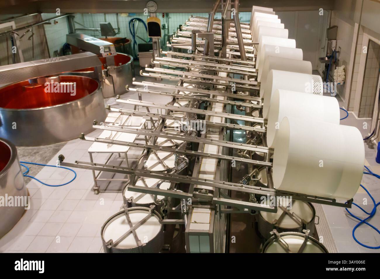 Interior of the cheese dairy factory. Equipment at cheese dairy plant ...