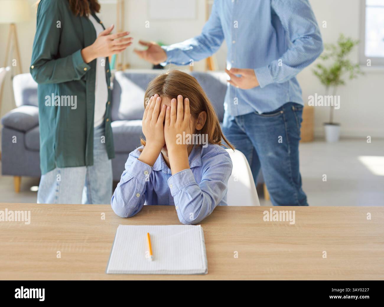 Sad Kid Crying During Parents Argument At Home Stock Photo - Alamy