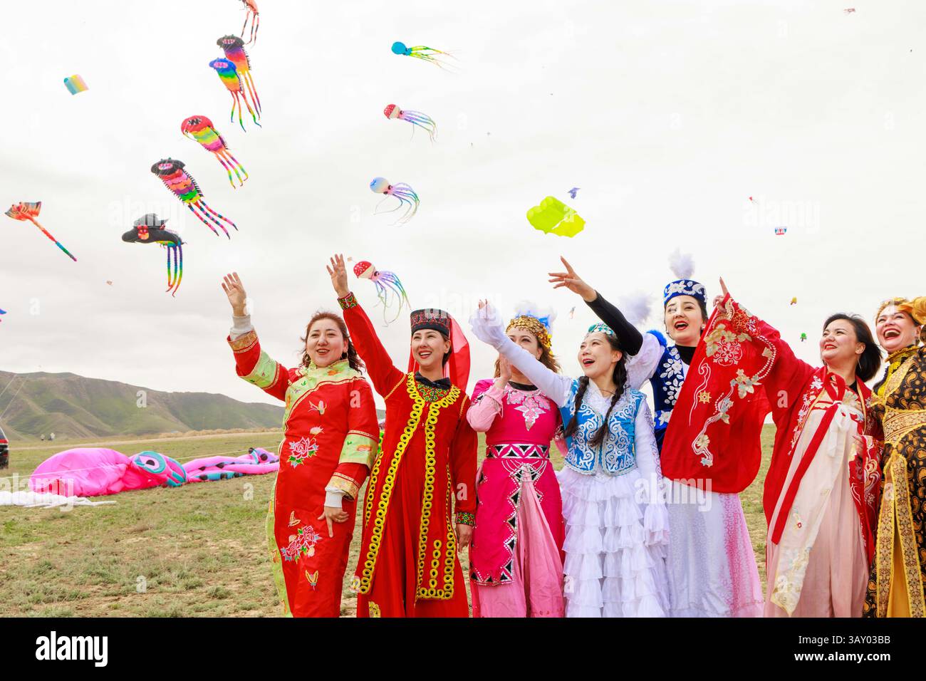 People take part in a kite festival in Urumqi City, northwest China's ...