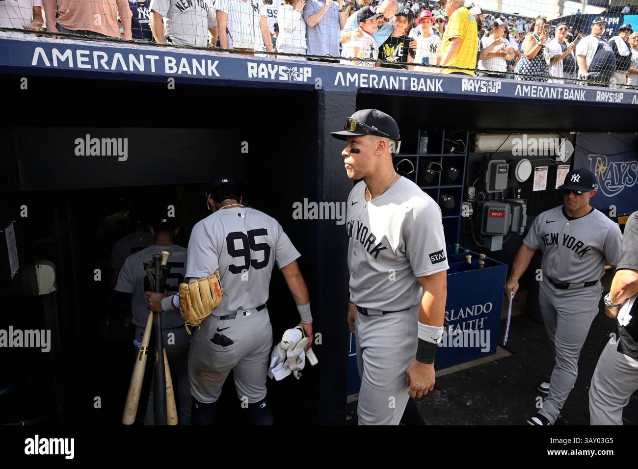 New York Yankees outfielder Aaron Judge, center, leaves the dugout ...