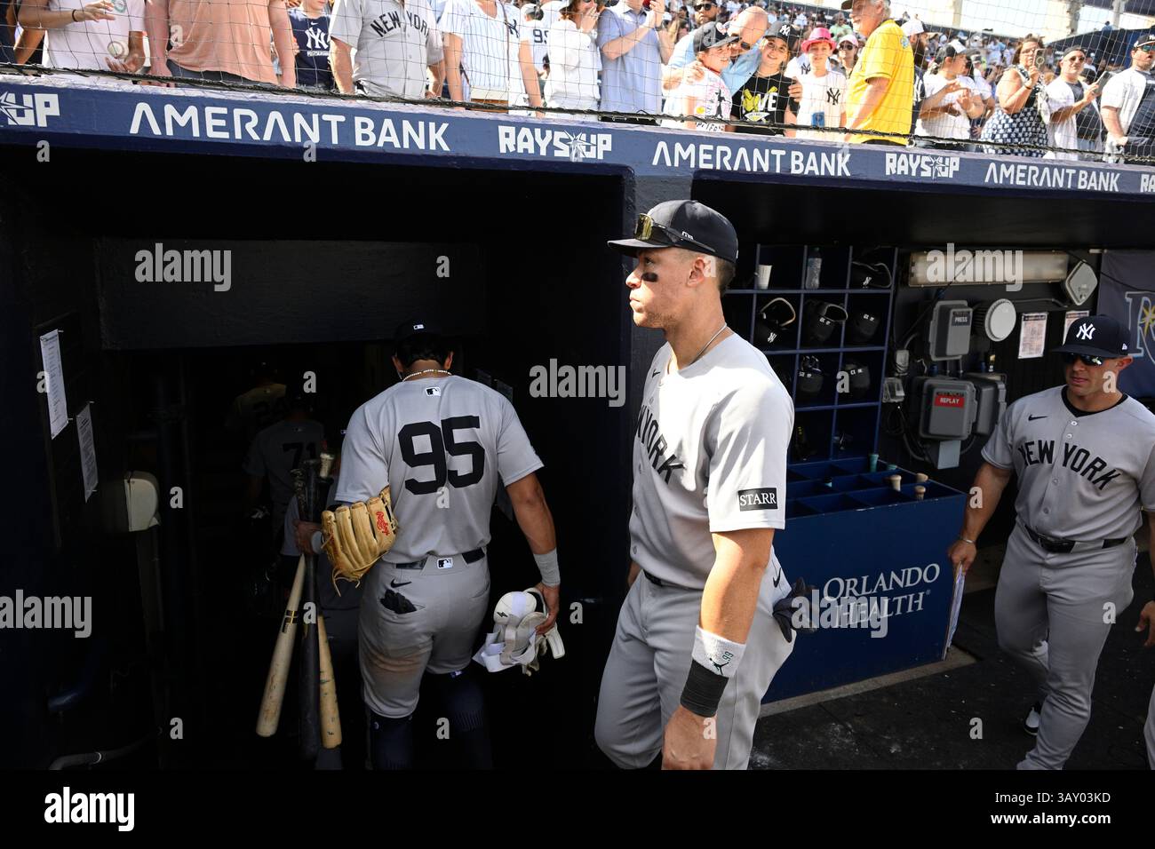 New York Yankees outfielder Aaron Judge, center, leaves the dugout ...