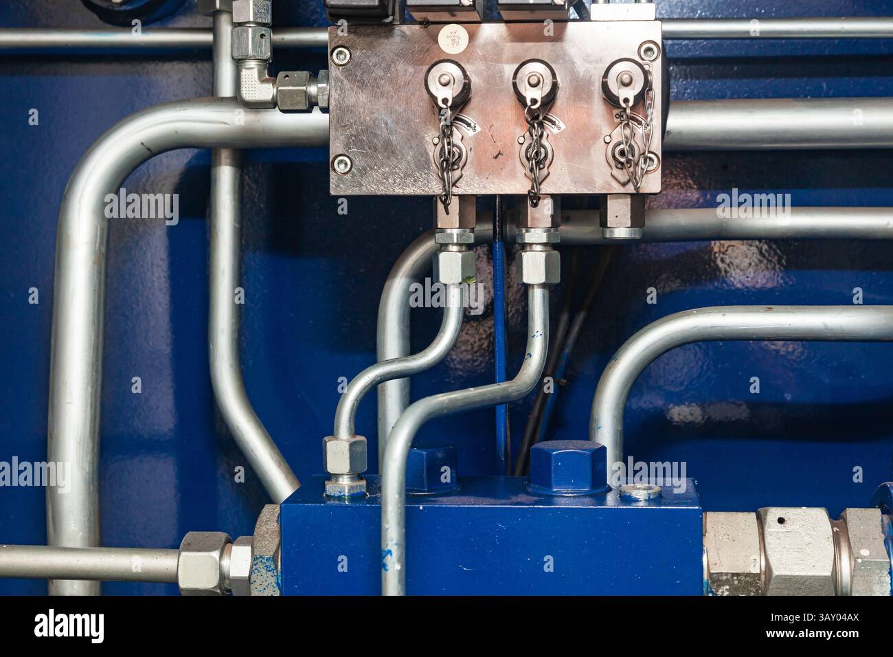 High pressure hydraulic hose system connected to steel pipes, close-up ...