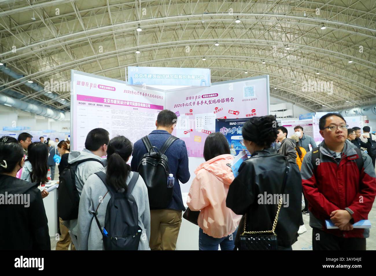 People look for jobs at a job fair in Beijing, China, 19 April, 2025 ...