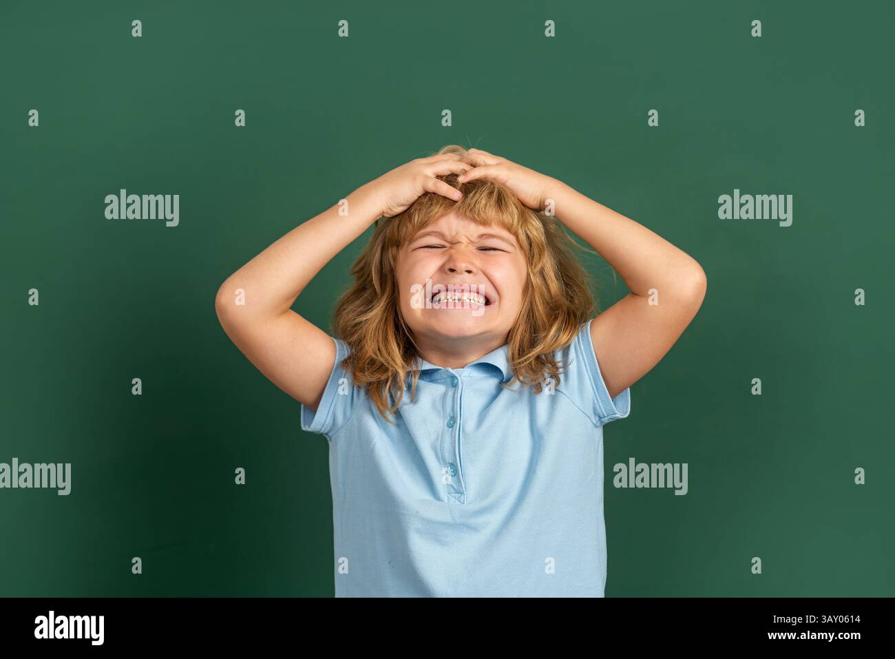 Headache. Boy touching head and have a migraine. Angry little boys with ...