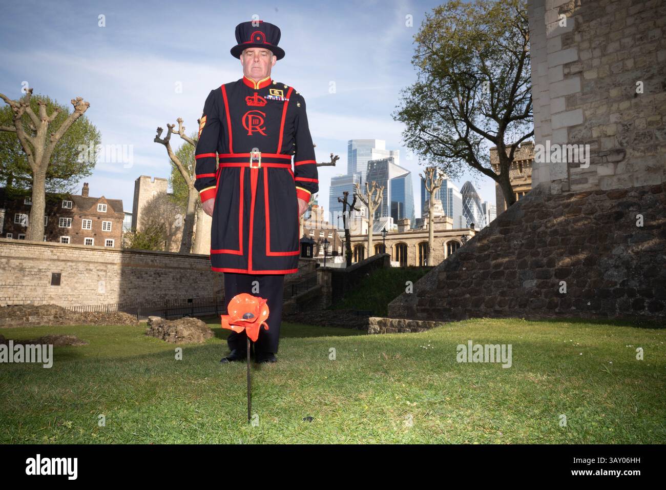 A first poppy is installed by Chief Yeoman Warder, Rob Fuller at the ...