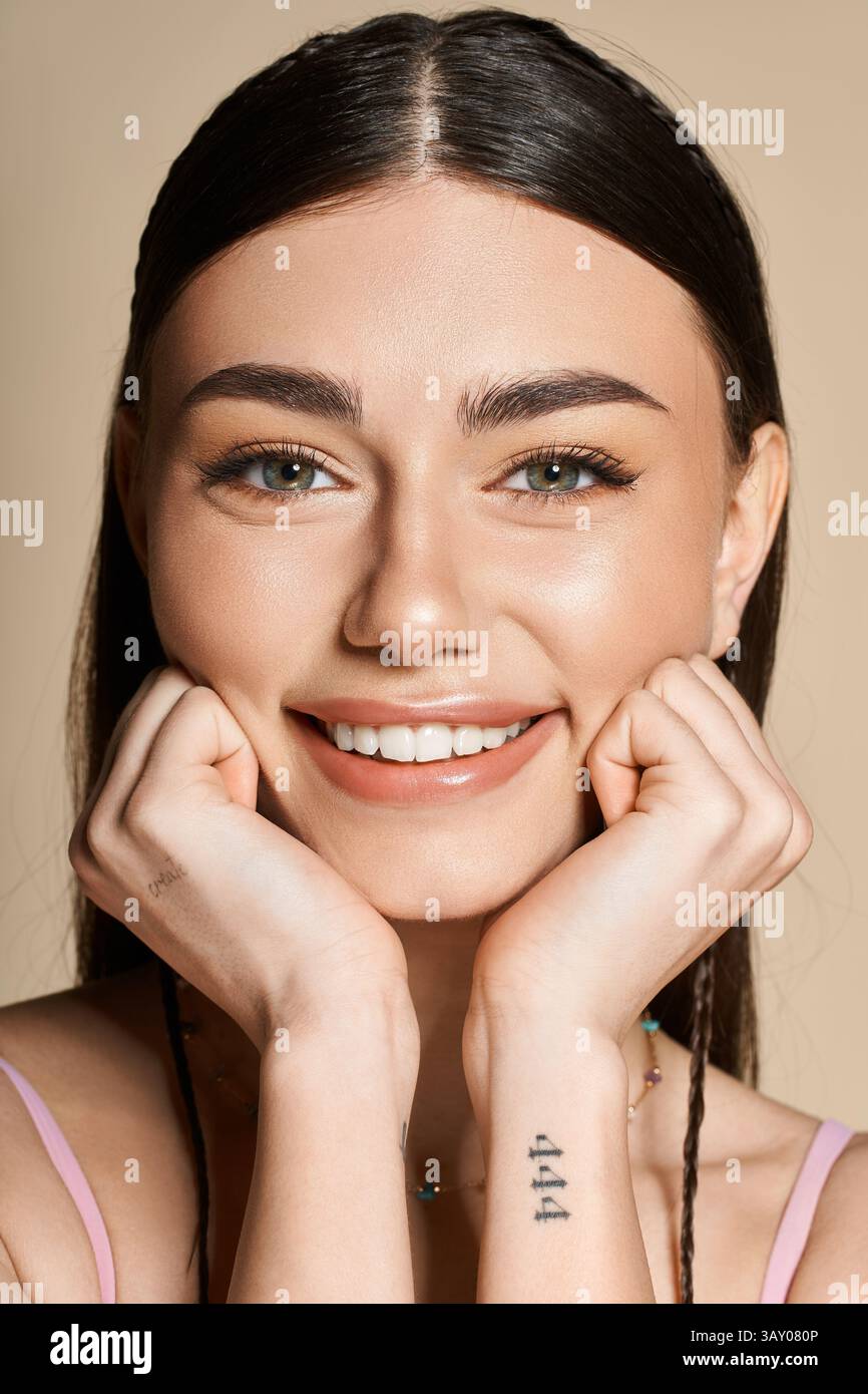 A young woman enjoys warm sunlight, showcasing her beautiful tan and ...