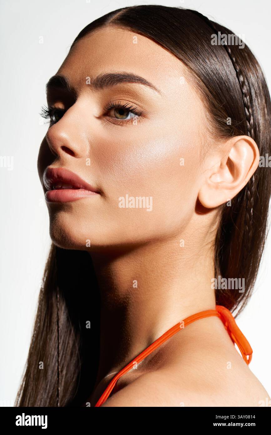 Bright summer vibes radiate as a young woman flaunts her beautiful tan ...