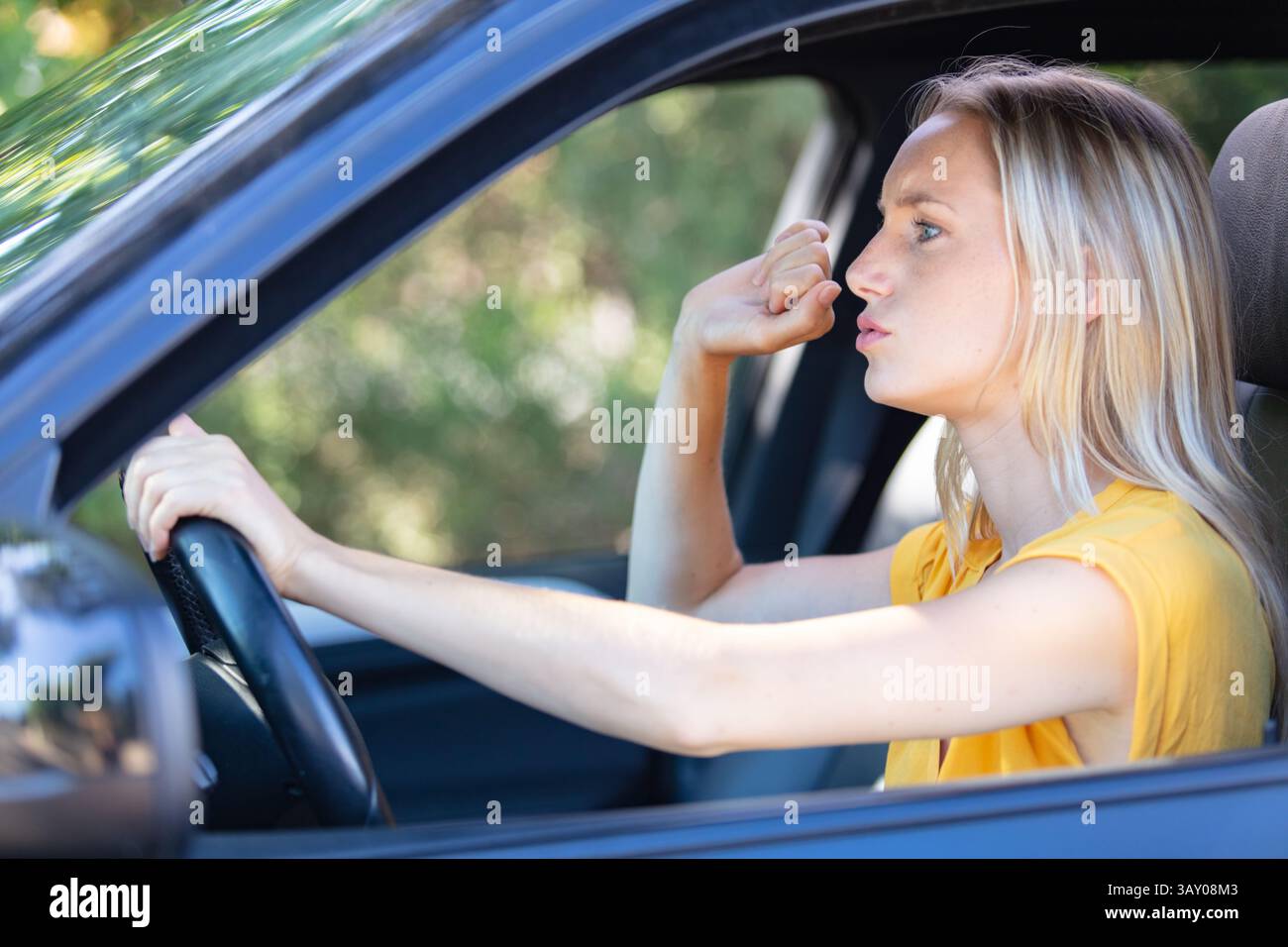 aggressive woman driving car shouting at someone Stock Photo - Alamy