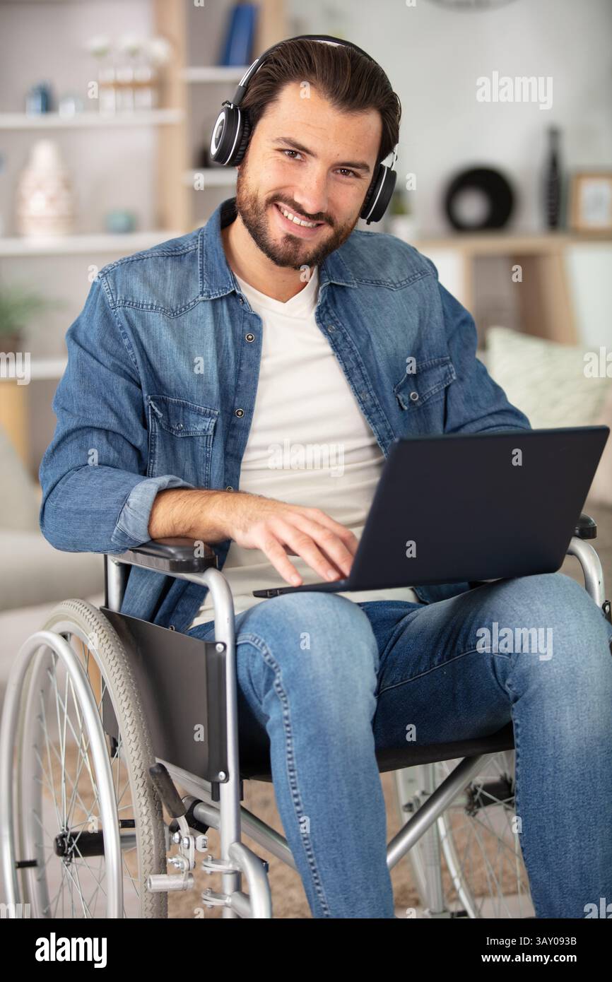 disabled man listening to music in wheelchair Stock Photo - Alamy