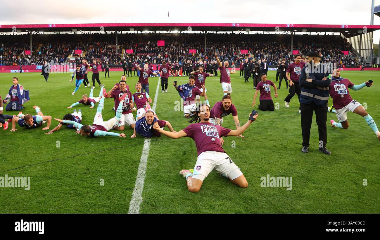 Burnley, England, 21st April 2025. Burnley players celebrate promotion ...