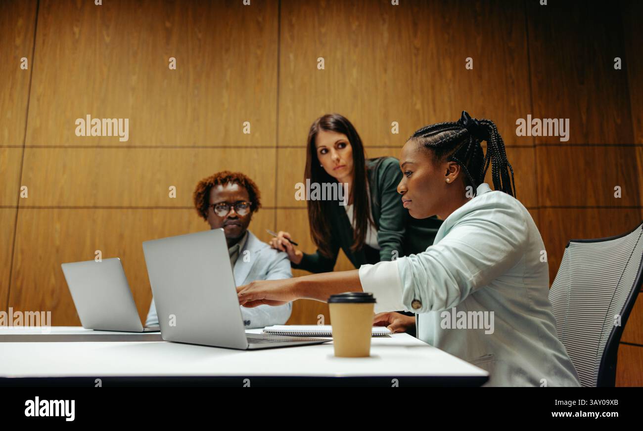 Diverse professional team members engaged hi-res stock photography and ...