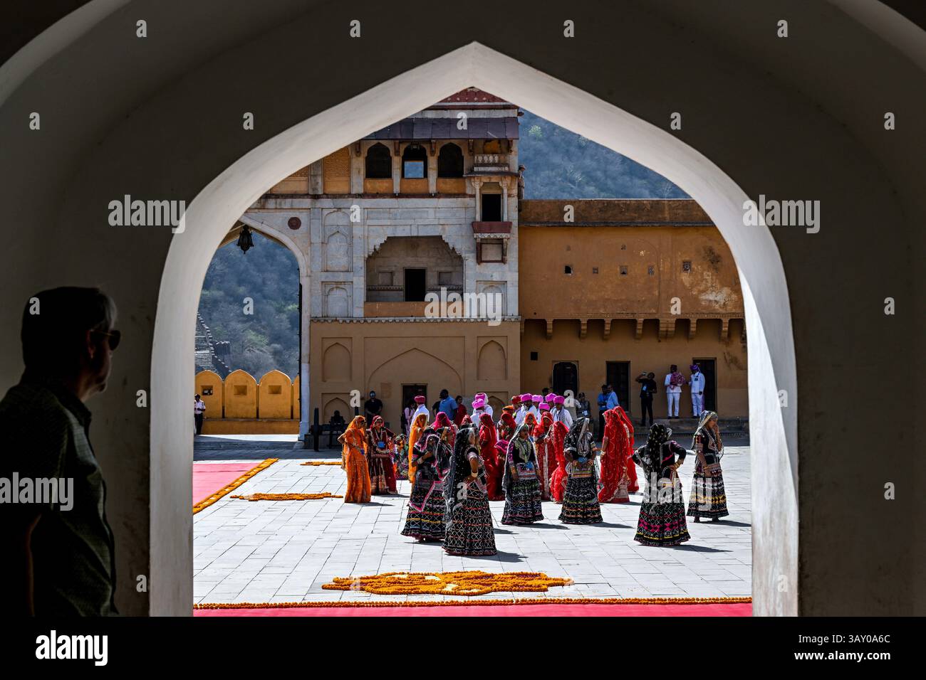 Men and women dressed in traditional attire prepare to do a cultural ...